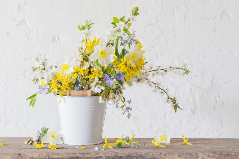 Spring Flowers in Bucket on Old Wooden Table Stock Image - Image of ...