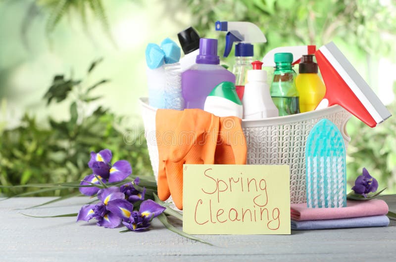 Spring Flowers and Cleaning Supplies on Wooden Table Stock Photo ...