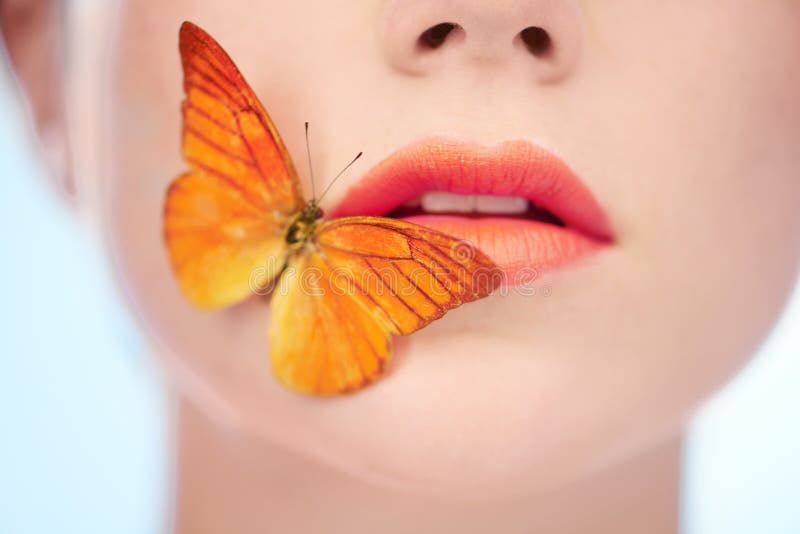 Spring-fresh Skin. a Butterfly Sitting on the Side of a Womans Mouth ...