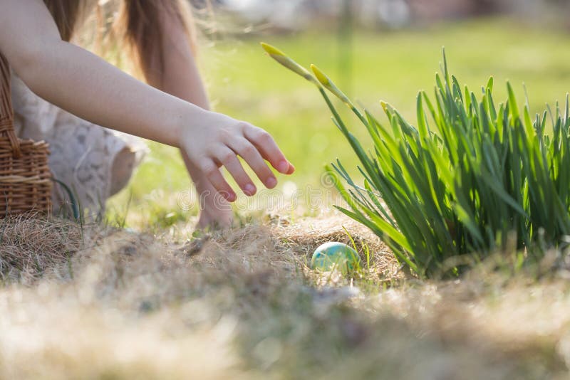 Spring Fun - Finding Eggs for Easter Outdoor in Countryside. Stock ...