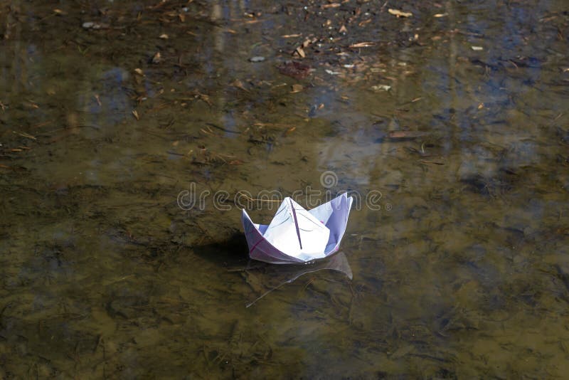 Spring Fun. Home-made Children S Boat Floating in a Puddle Stock Image ...