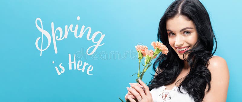 Spring is Here Message with Young Woman Holding Carnations Stock Photo ...