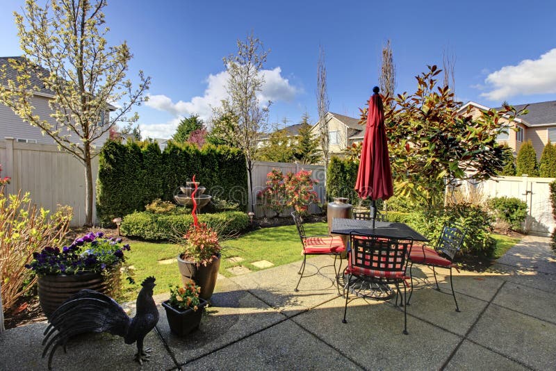 House Spring Backyard with Rock Wall and Kids Playground. Stock Photo ...