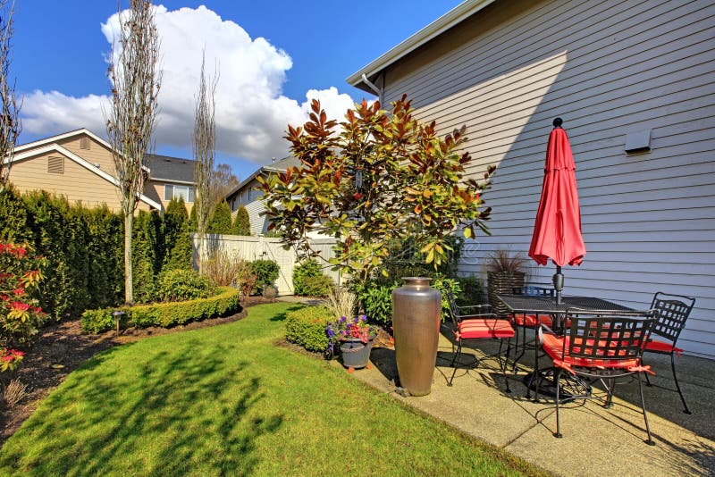 House Spring Backyard with Rock Wall and Kids Playground. Stock Photo ...