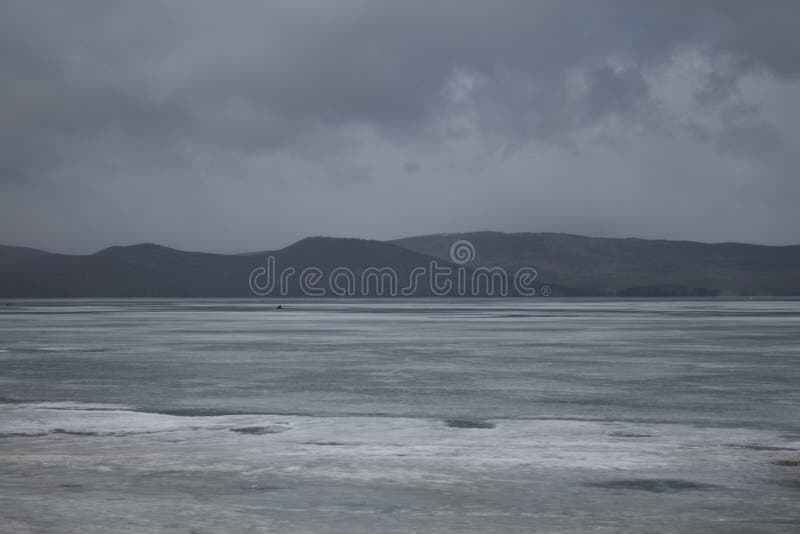 Spring Ice on the Mountain Lake Stock Photo - Image of mountains ...