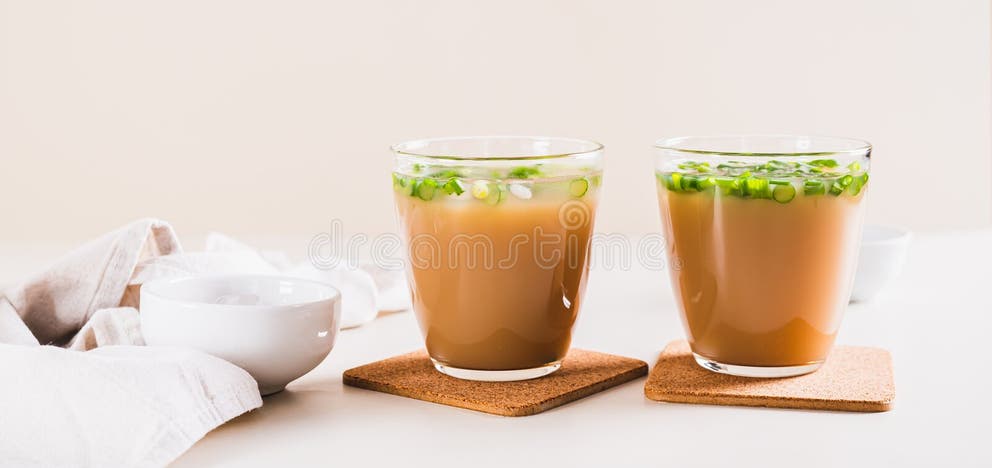 Spring Iced Scallion Latte in Glasses on the Table Web Banner Stock ...
