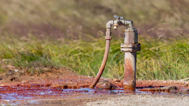 Spring in Iceland, Tapping Water Stock Image - Image of drink, brown ...