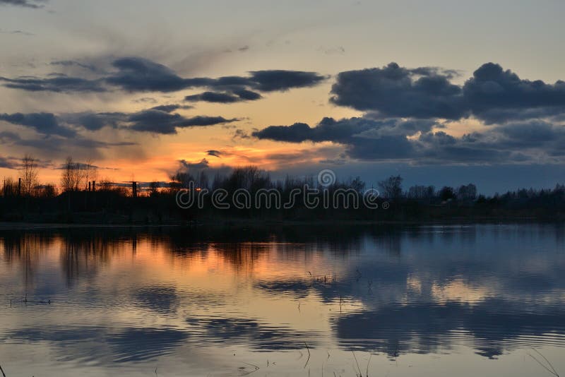 Spring Landscape with Dramatic after-sunset Sky Reflected in the Water ...