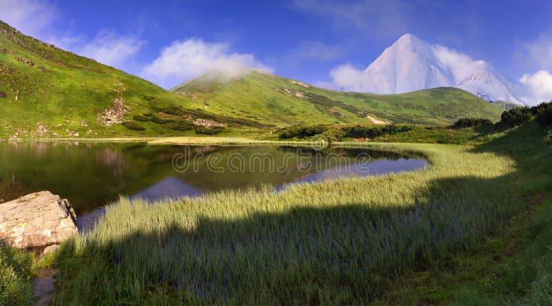 Spring landscape with lake stock photo. Image of peak - 24003654