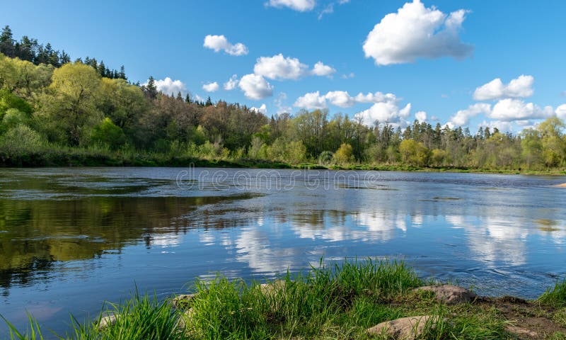 Spring Landscape with a River, in the Waters of Which Clouds are ...