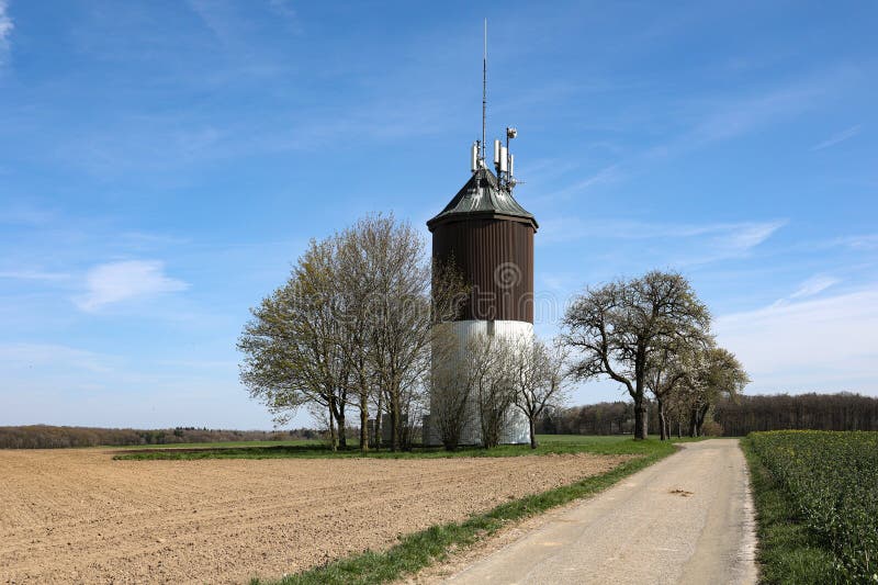 Spring Landscape with Water Tower by the Road Stock Image - Image of ...