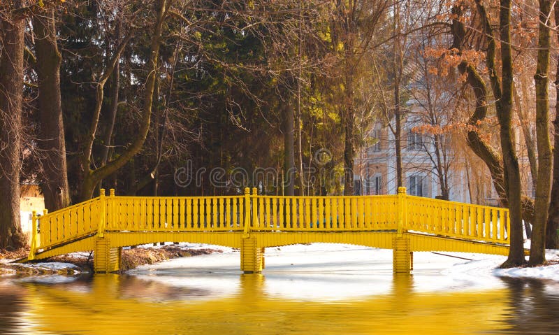 Spring Landscape with Yellow Bridge Over a Lake Stock Photo - Image of ...