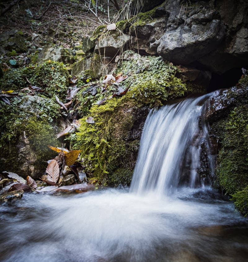 A Spring in the Mountains with Clean Drinking Water Flows from Stones ...