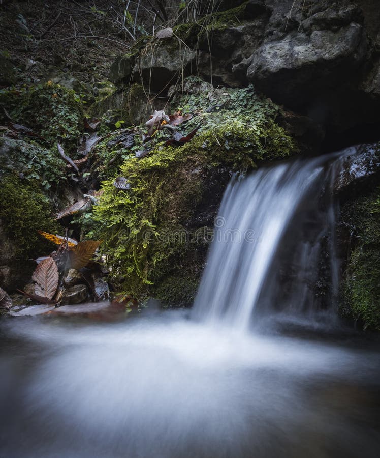 A Spring in the Mountains with Clean Drinking Water Flows from Stones ...