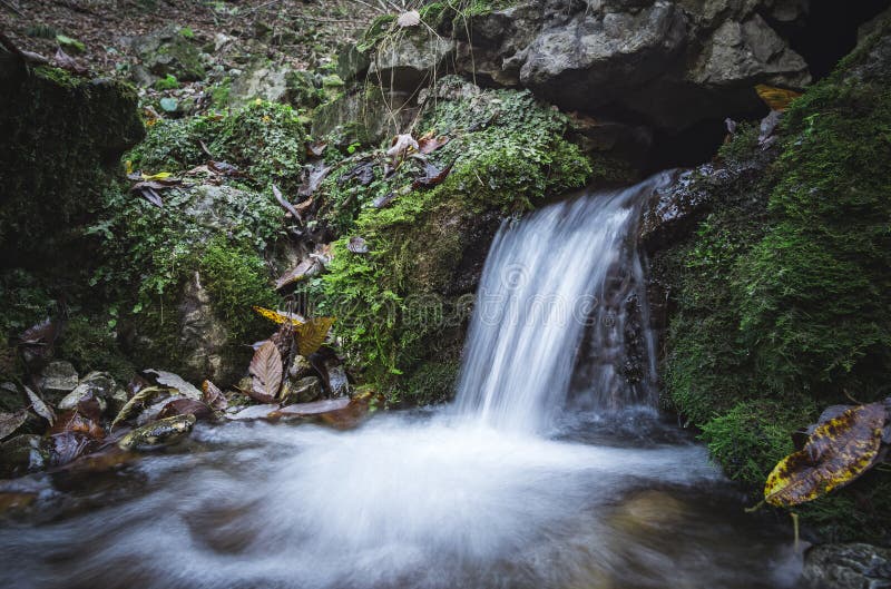 A Spring in the Mountains with Clean Drinking Water Flows from Stones ...