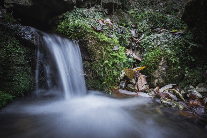 A Spring in the Mountains with Clean Drinking Water Flows from Stones ...