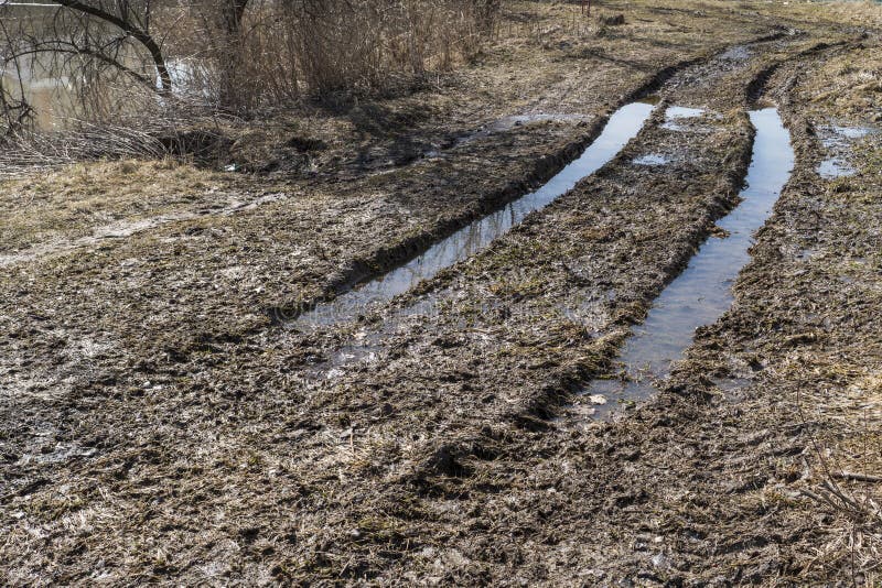 Spring Mud, Wet Soil with Tire Prints Stock Photo - Image of puddle ...
