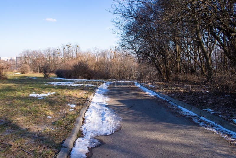 Spring Park with Paths and Snow Stock Image - Image of flying, girl ...