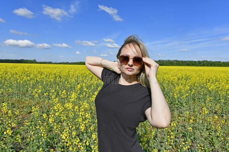 Spring Portraits of a Beautiful Woman Against a Background of Flowers ...
