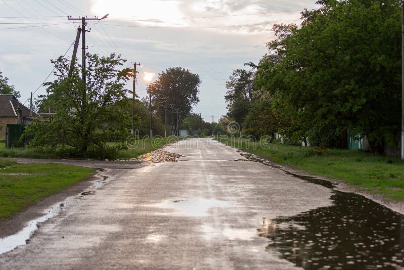 Spring Rain and Puddles on a Rural Road Stock Image - Image of droplet ...