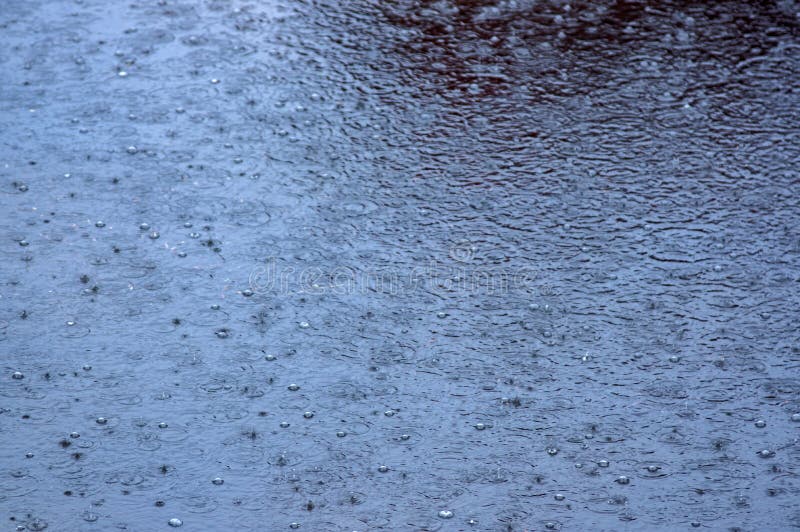 A Puddle in the Pouring Rain of Spring. Stock Image - Image of bubbles ...