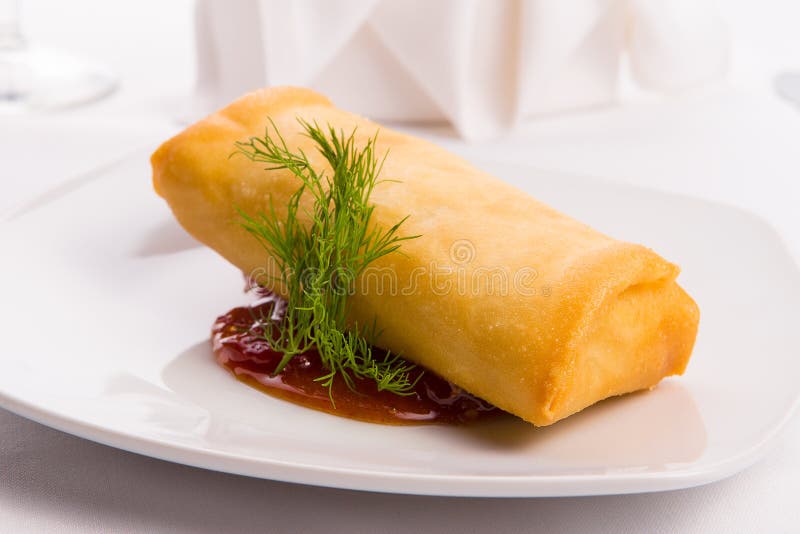 Spring Roll Elegantly Complimented with Dill and Served on Sweet Stock ...