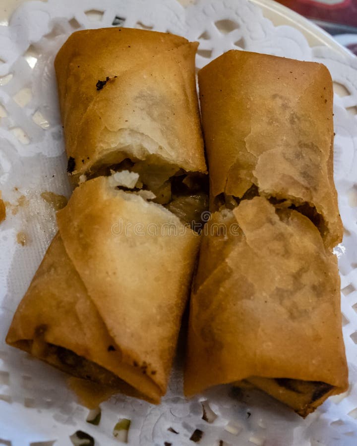 Spring Rolls in a Plate in Front of Bamboo Steamers Stock Image - Image ...