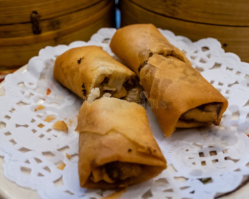 Spring Rolls in a Plate in Front of Bamboo Steamers Stock Image - Image ...