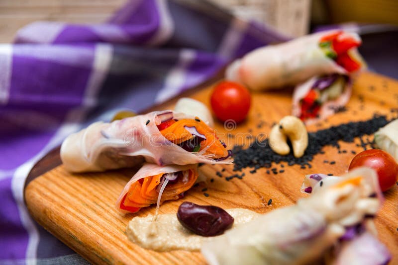 Spring Rolls on a Wooden Board, Beautifully Decorated Appetizers Stock ...