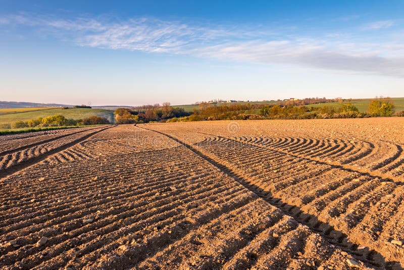 Spring Rural Countryside with Ruts in Plowed Field Stock Photo - Image ...