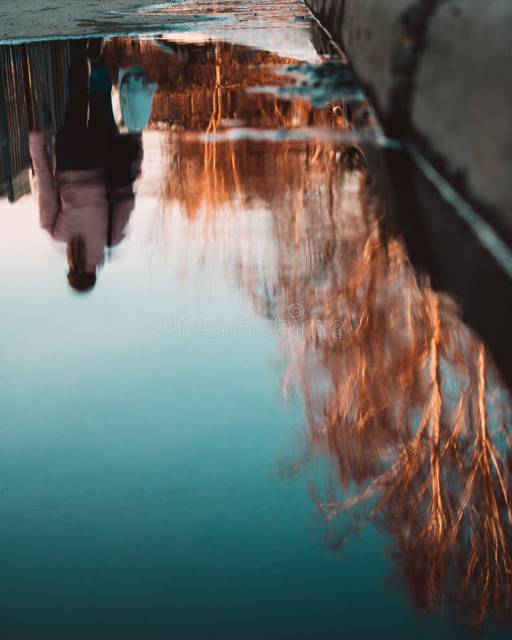 Spring Russian Landscape Reflected in a Puddle on the City Streets ...
