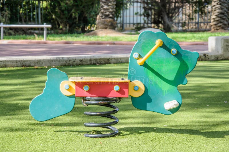 Spring Seesaw in the Playground Stock Photo - Image of field, exercise ...