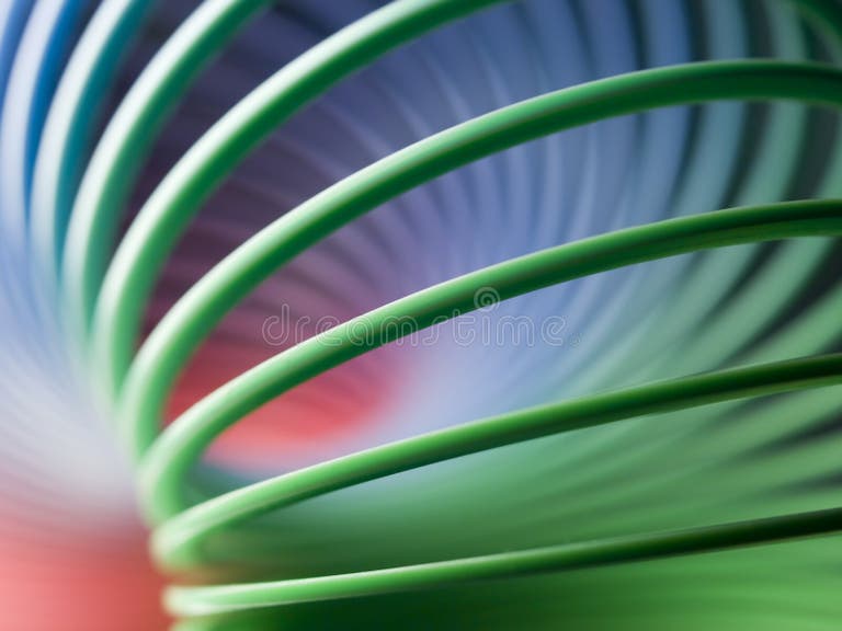 Spring slinky background editorial image. Image of spiral - 12892645