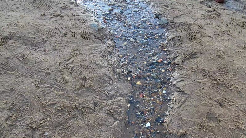 A Spring Stream from Melting Snow on the Sand. the Flow of a Stream ...