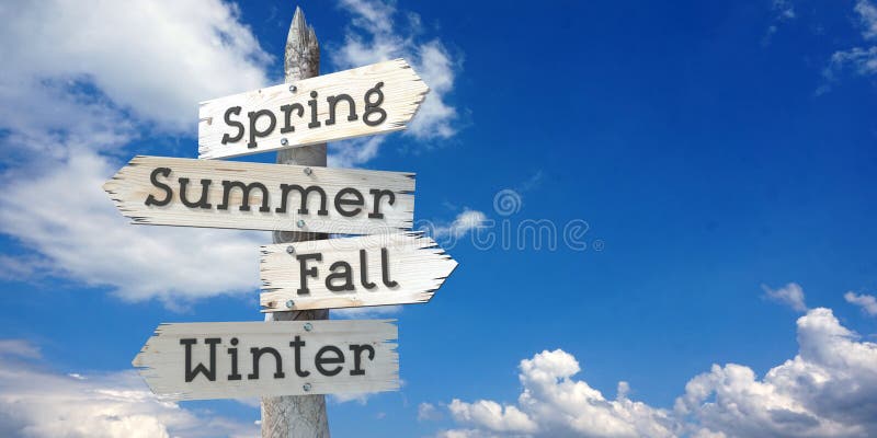 Spring, Summer, Fall, Winter - Wooden Signpost with Four Arrows Stock ...