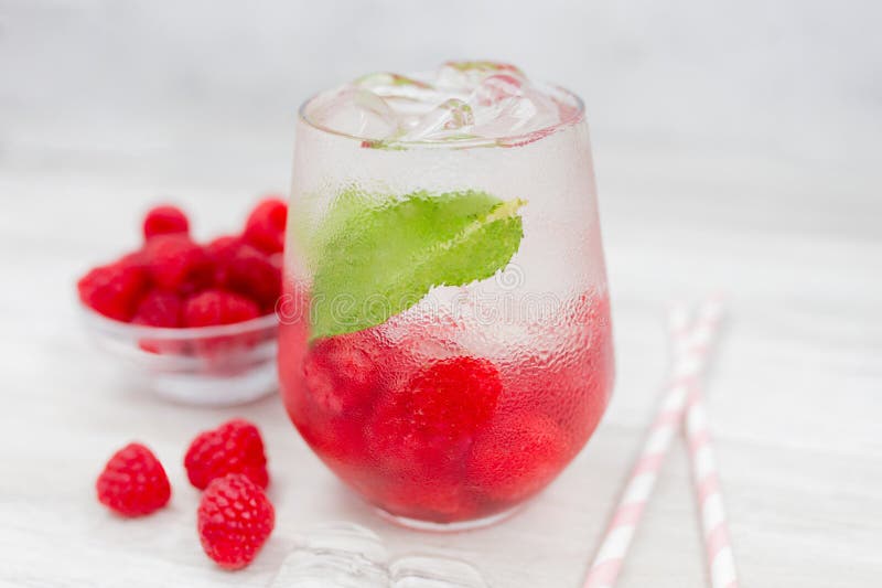 Spring or Summer Refreshing Cold Water with Raspberry and Ice. Berry ...