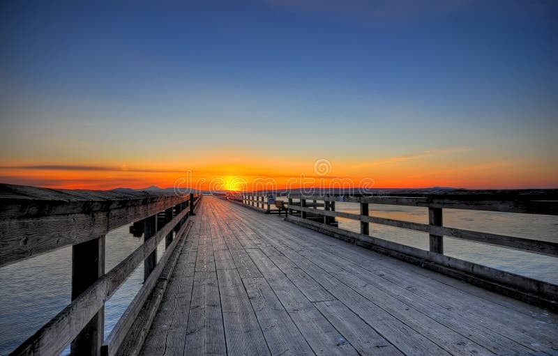 Pier in sunset stock image. Image of holiday, lines, landing - 16349