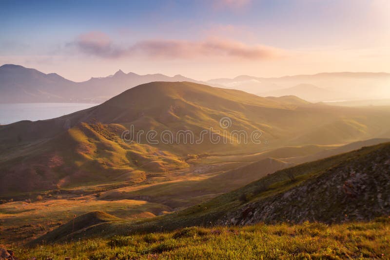 Spring Sunset in the Mountains. Seacoast and Hills Stock Photo - Image ...