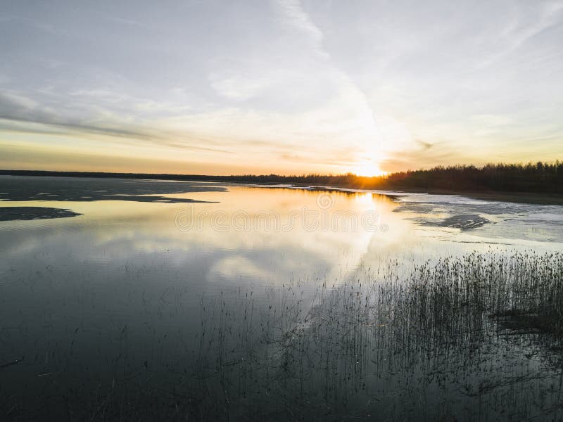 Spring Sunset Over the Water Stock Image - Image of blue, horizon ...