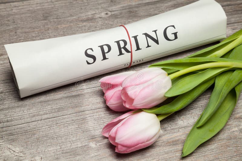 Happy Spring Text on Black Letter Board and Bouquet of Flowers on Pink ...