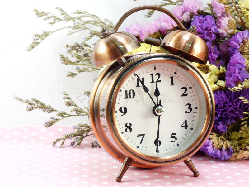 Spring Time with Alarm Clock and Statice Flowers Bouquet Background ...