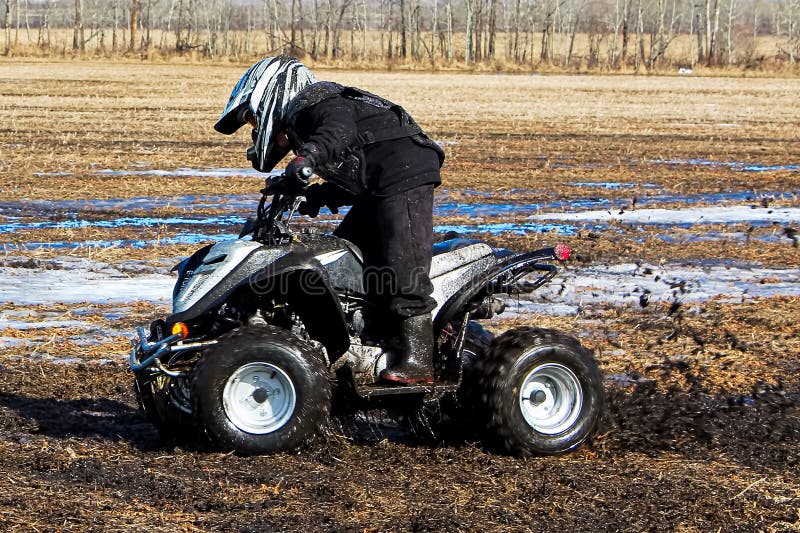 Spring Time Quading through the Mud Stock Photo - Image of activity ...