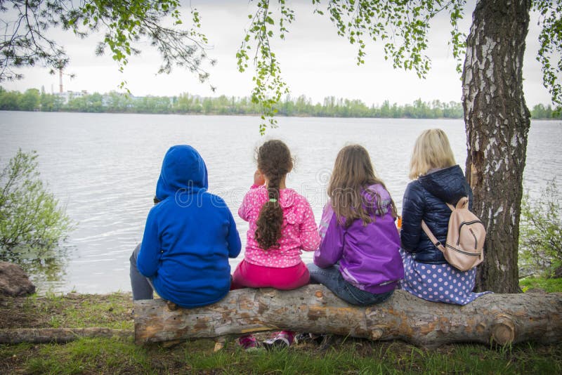 Spring in the Woods Sitting on a Log and Small Children Drink Te Stock ...