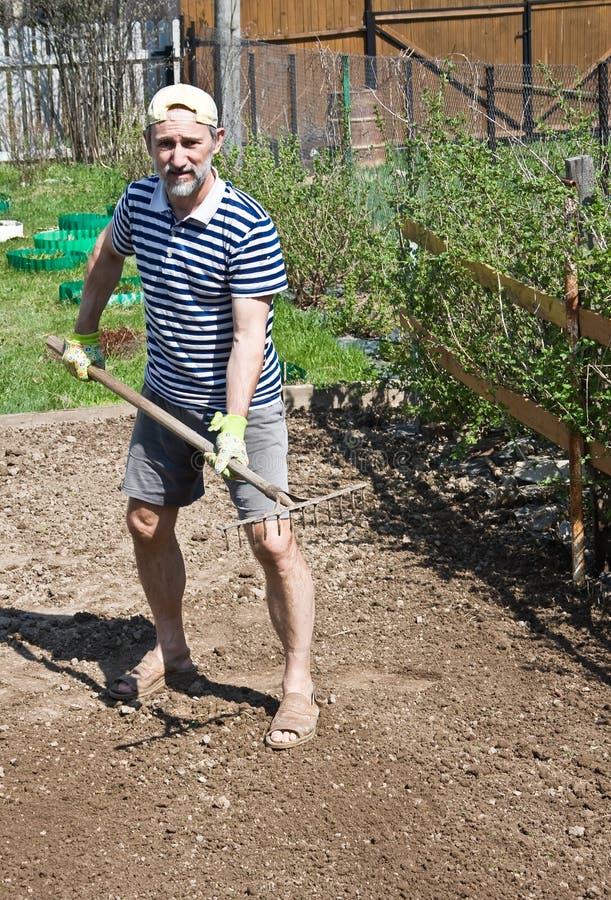 Spring works in the garden stock photo. Image of people - 18645646