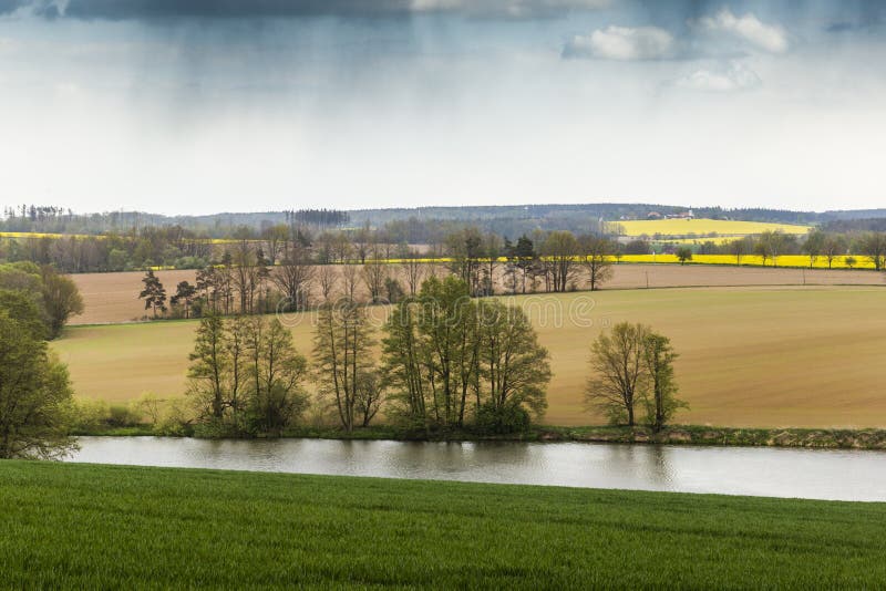 Springtime Countryside with Green Pasture and Sky with Clouds Stock ...