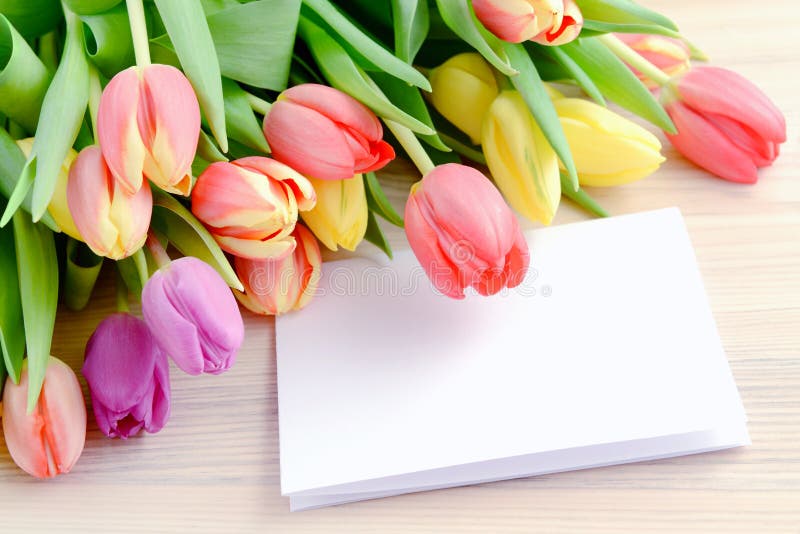 Springtime Decoration with Tulips and White Note Paper Copy Space Stock ...