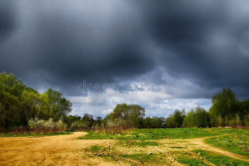 A Springtime Landscape with Green Trees and a Stretched Storm on Stock ...