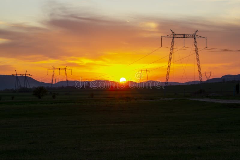 Springtime Landscape at the Sunset with Pylons Stock Photo - Image of ...