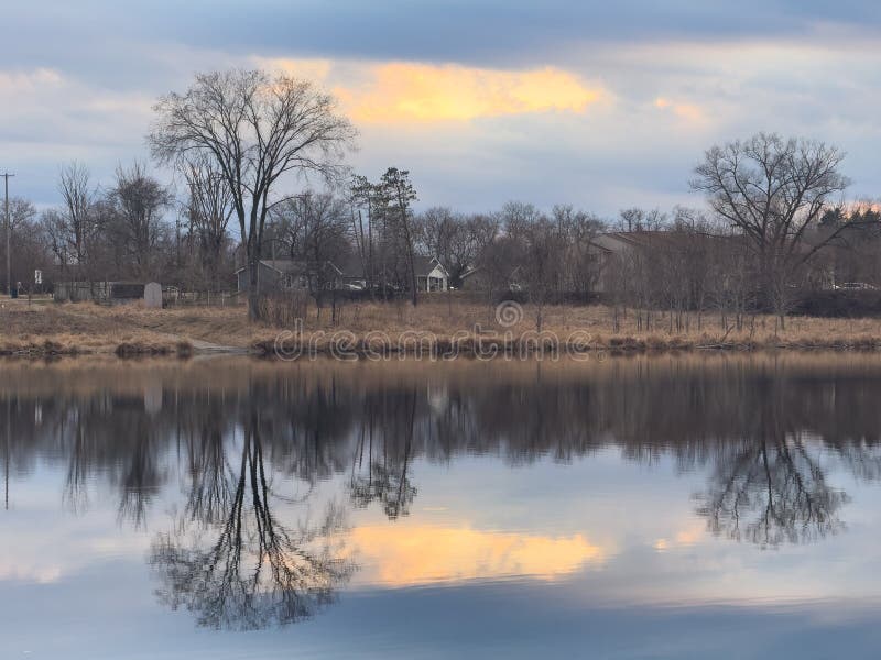Springtime Trees Reflected on the Lake at Sunset Stock Image - Image of ...
