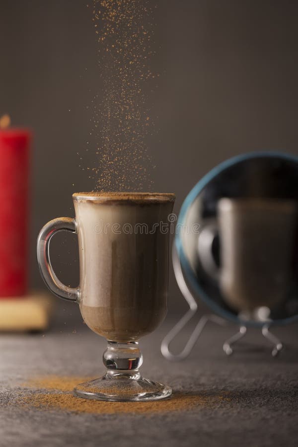 Sprinkle Cinnamon Powder Over the Hot Chocolate. Close Up Stock Photo ...